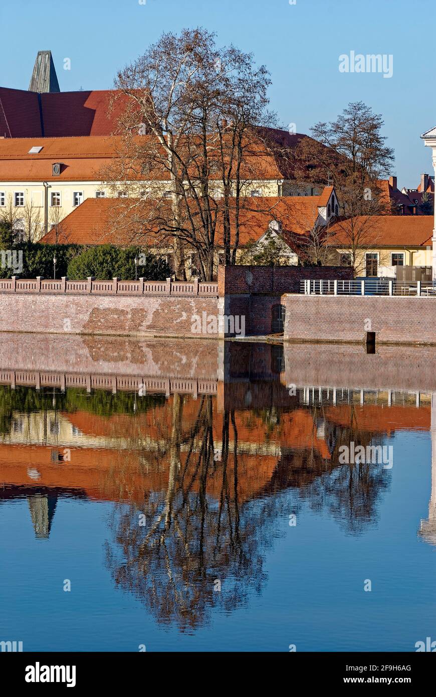 River embankment - symmetrical reflection. Reflection of Ostrow Tumski ...