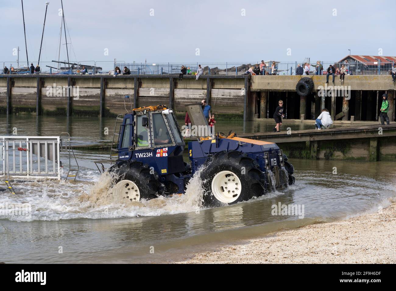 Beach tractor returning to shore from Sea after launching lifeboat into ...