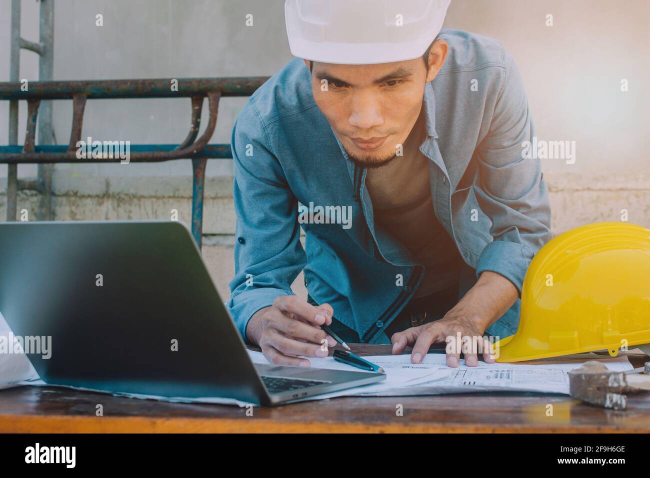 Engineer checking design building construction by computer technology ...