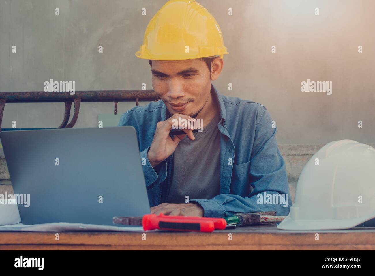 Asian man Engineer working design building construction , worker work ...