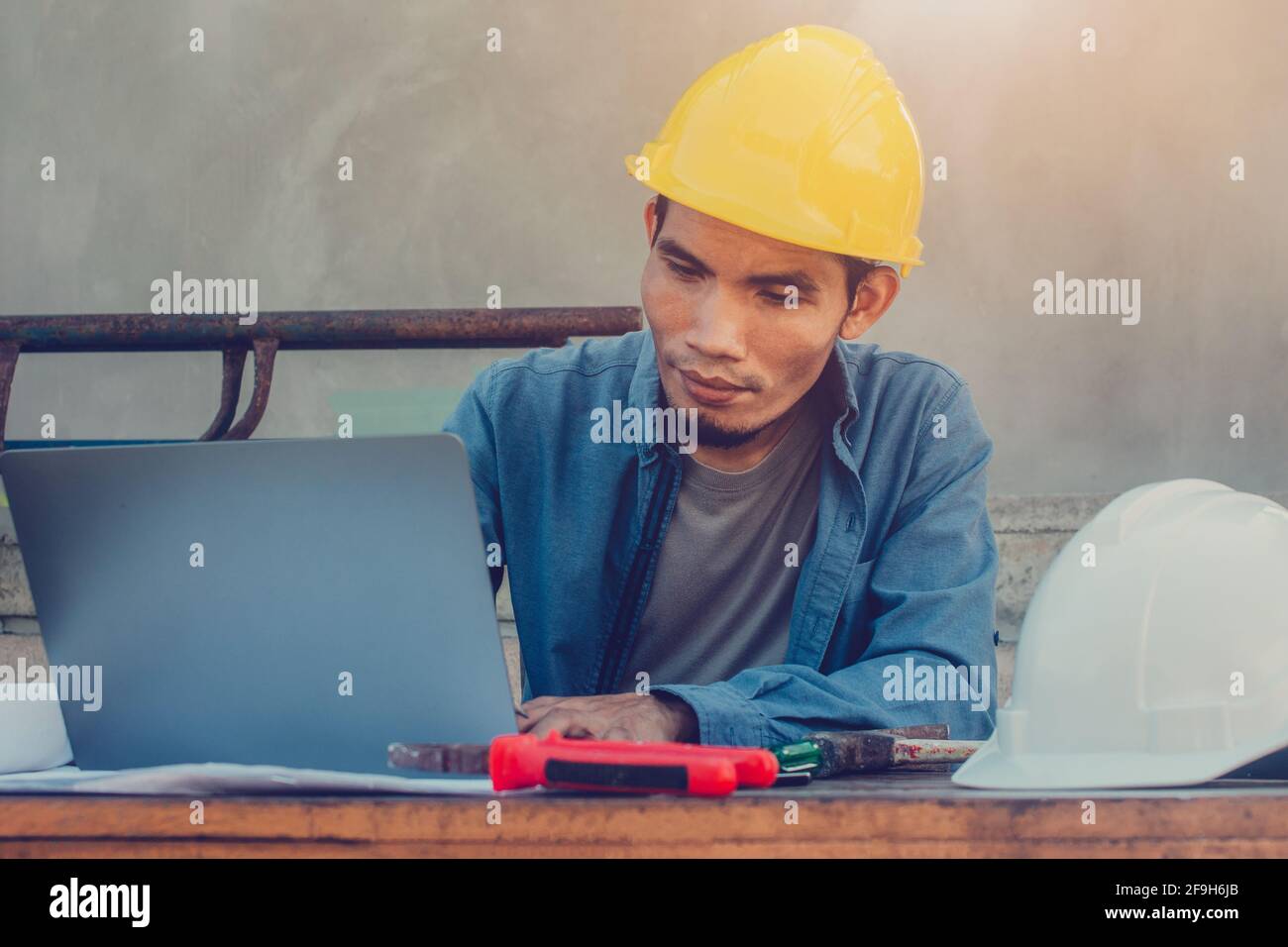 Asian man Engineer working design building construction , worker work ...