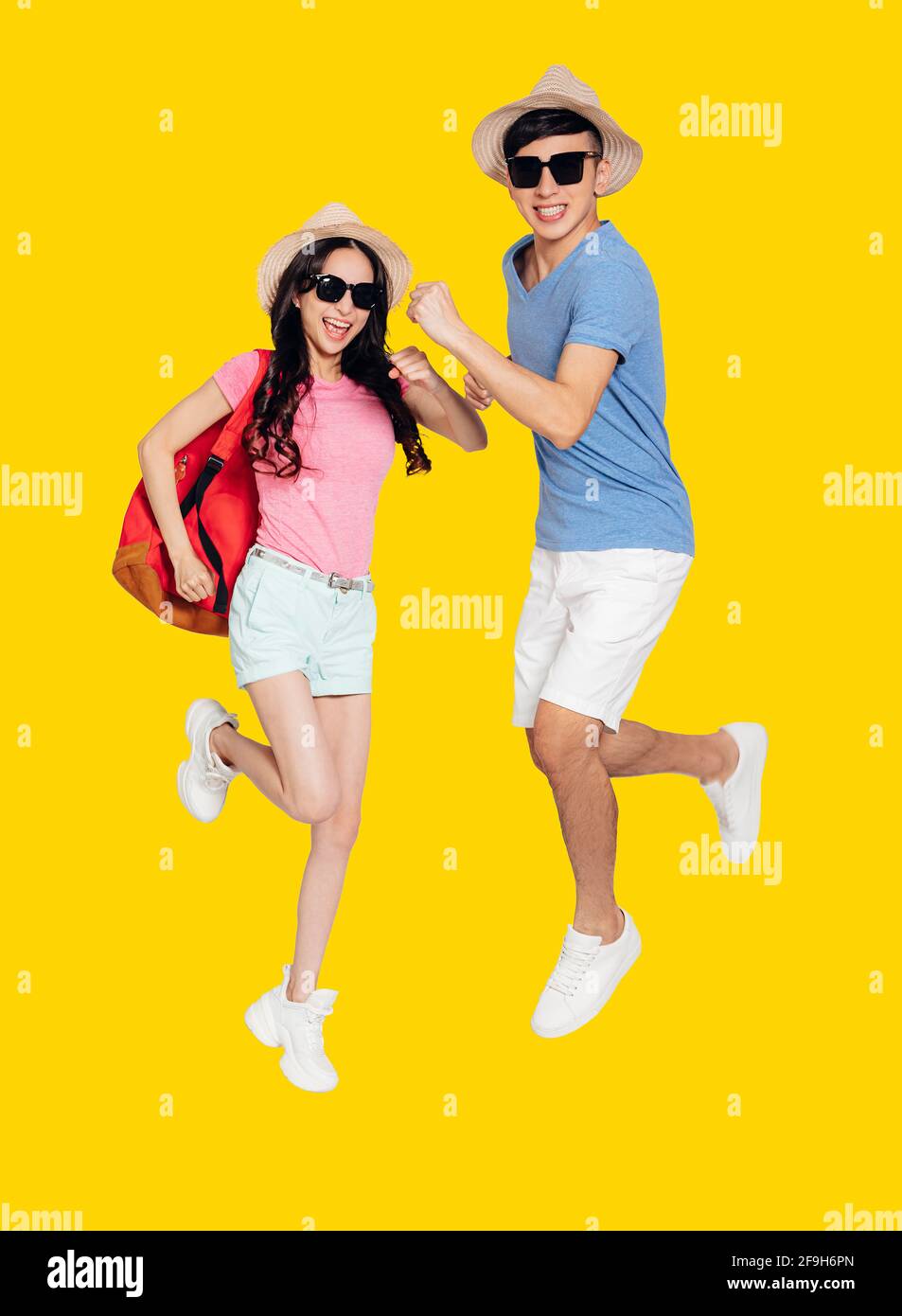 Happy excited young couple tourists jumping and ready for travel Stock ...