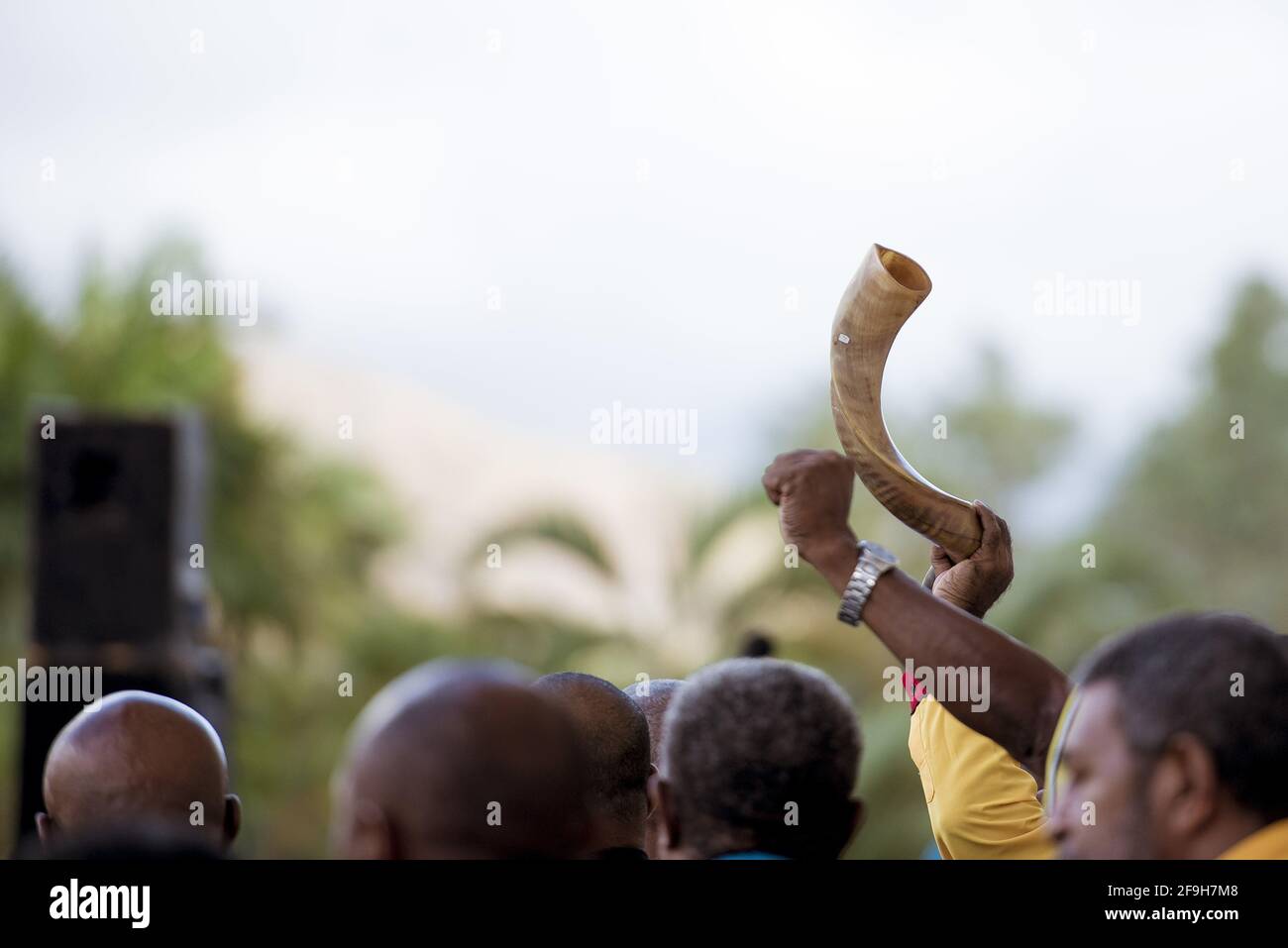 Crowd of African people with one of them holding a horn Stock Photo - Alamy