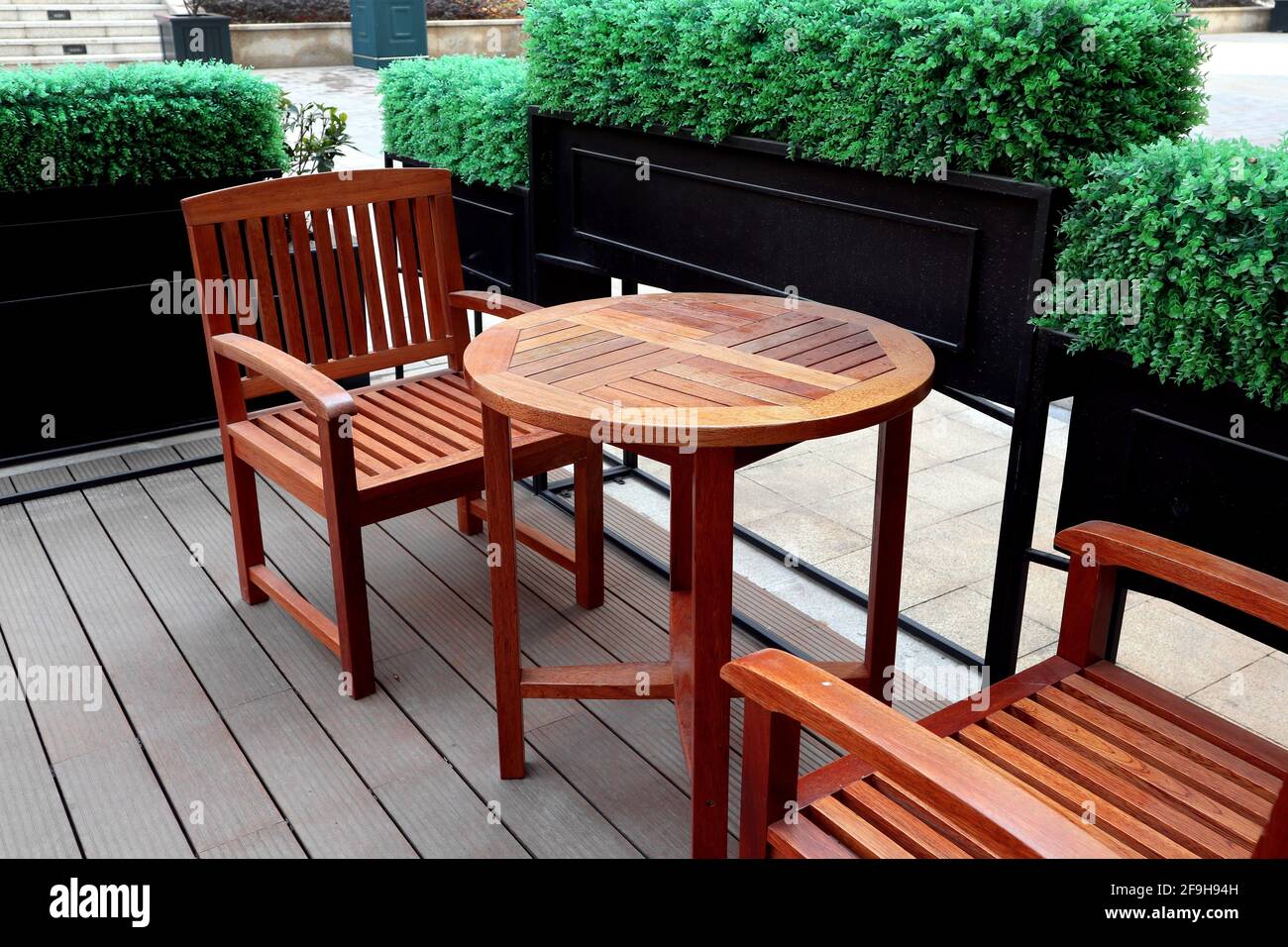 A chair for visitors to rest in a park Stock Photo - Alamy