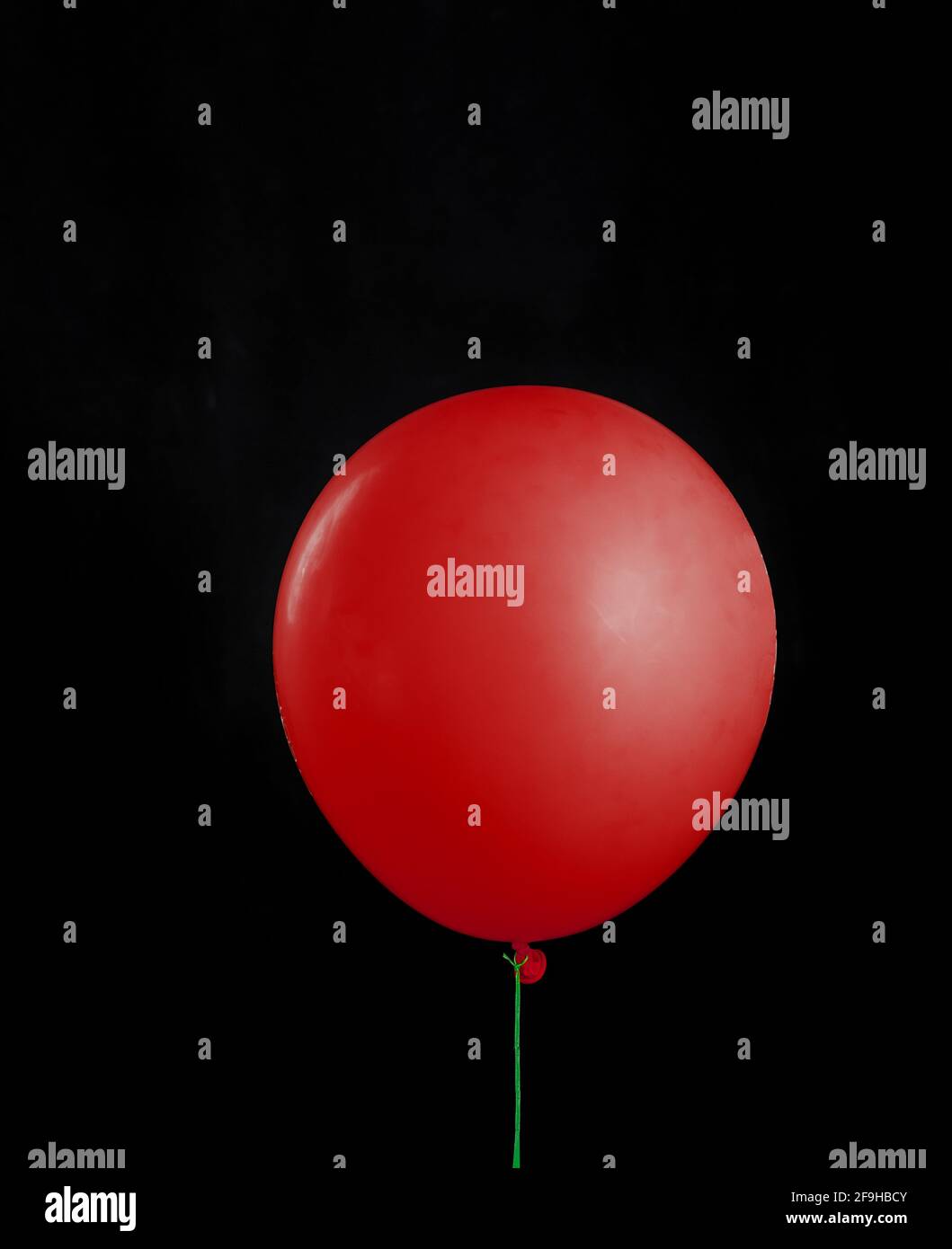 Beautiful red balloon on black isolated background. Layout gift concept ...