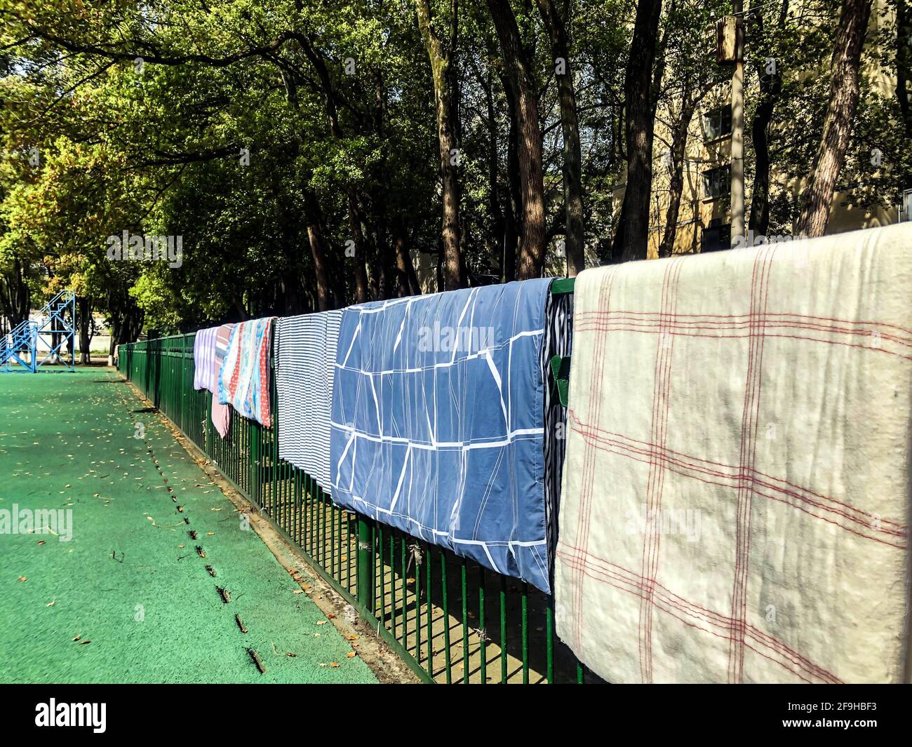 People hang their clothes and quilts out in the open on sunny days ...