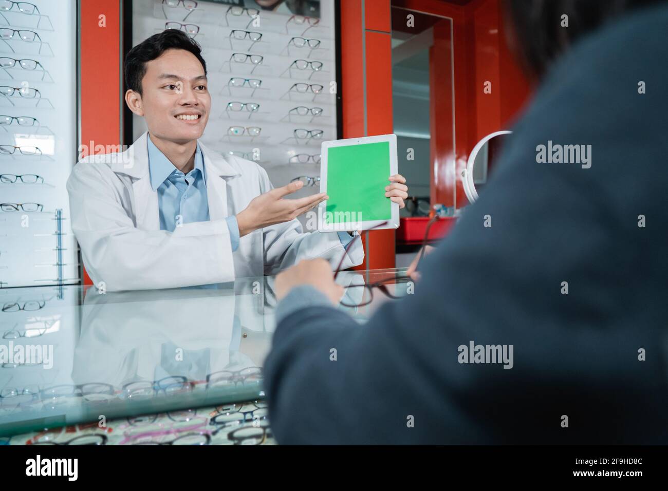 A male doctor is showing a color test board which is one of the basics ...