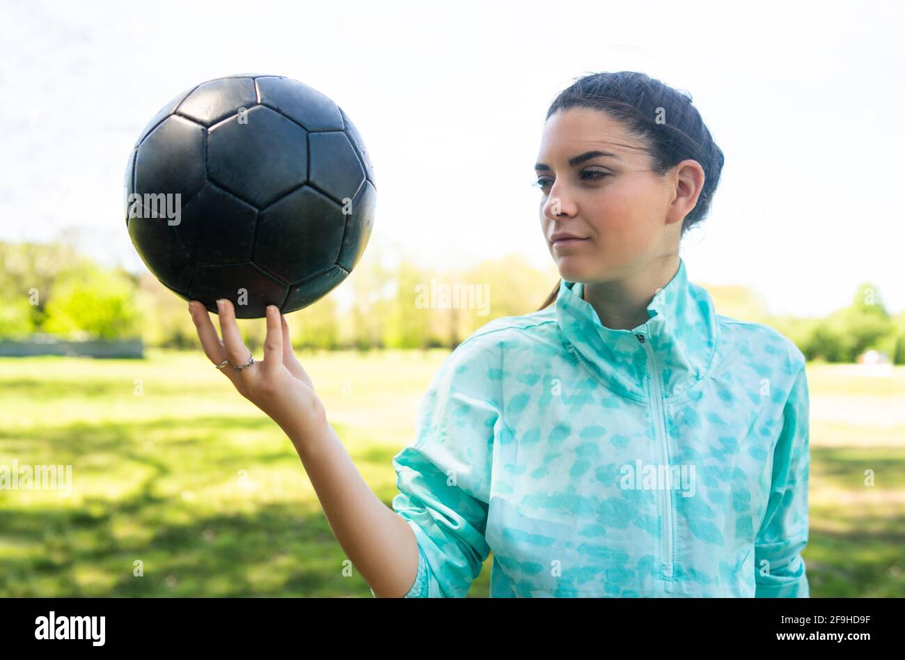 Female football player standing ball hi-res stock photography and ...
