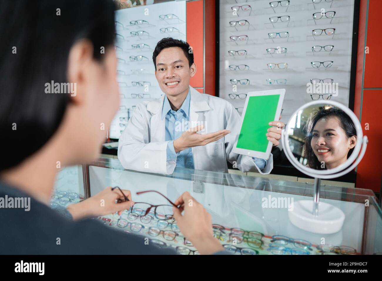 A male doctor is showing a color test board which is one of the basics ...
