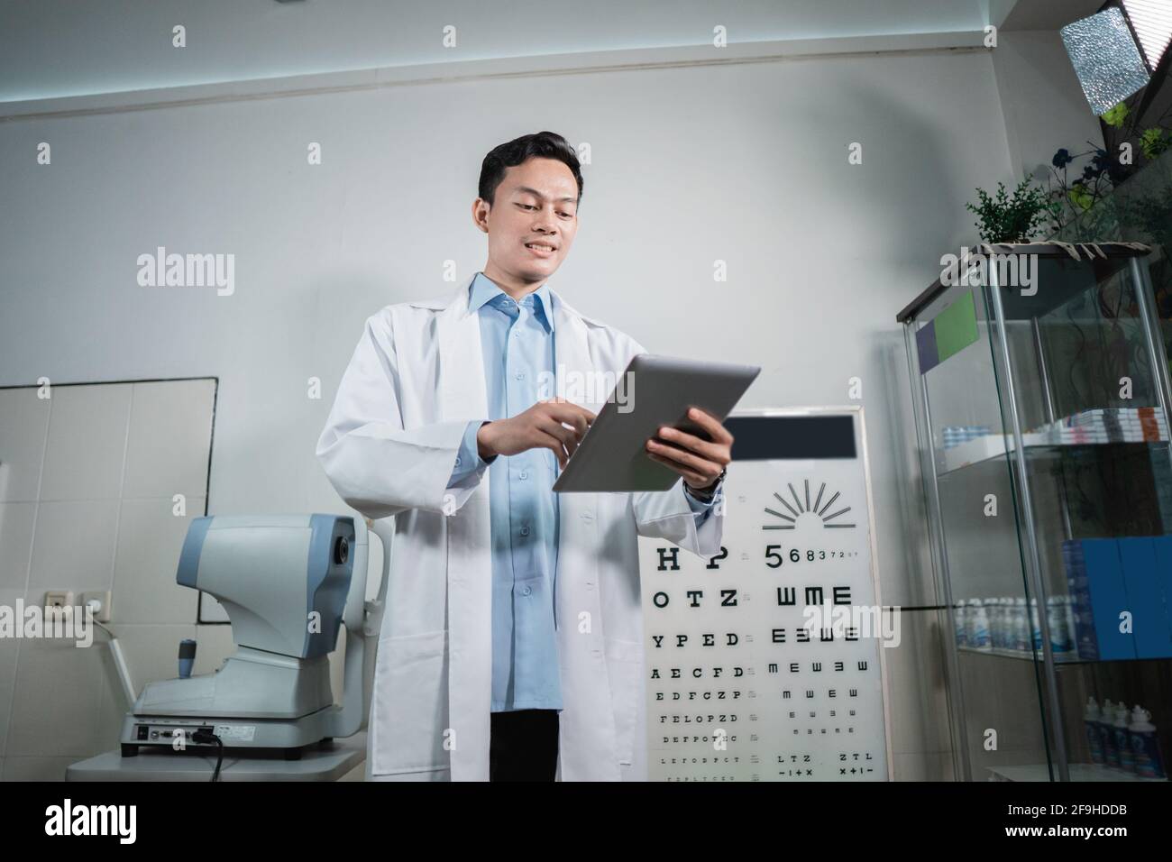 a male doctor maintains an eye checklist that forms the basis of ...