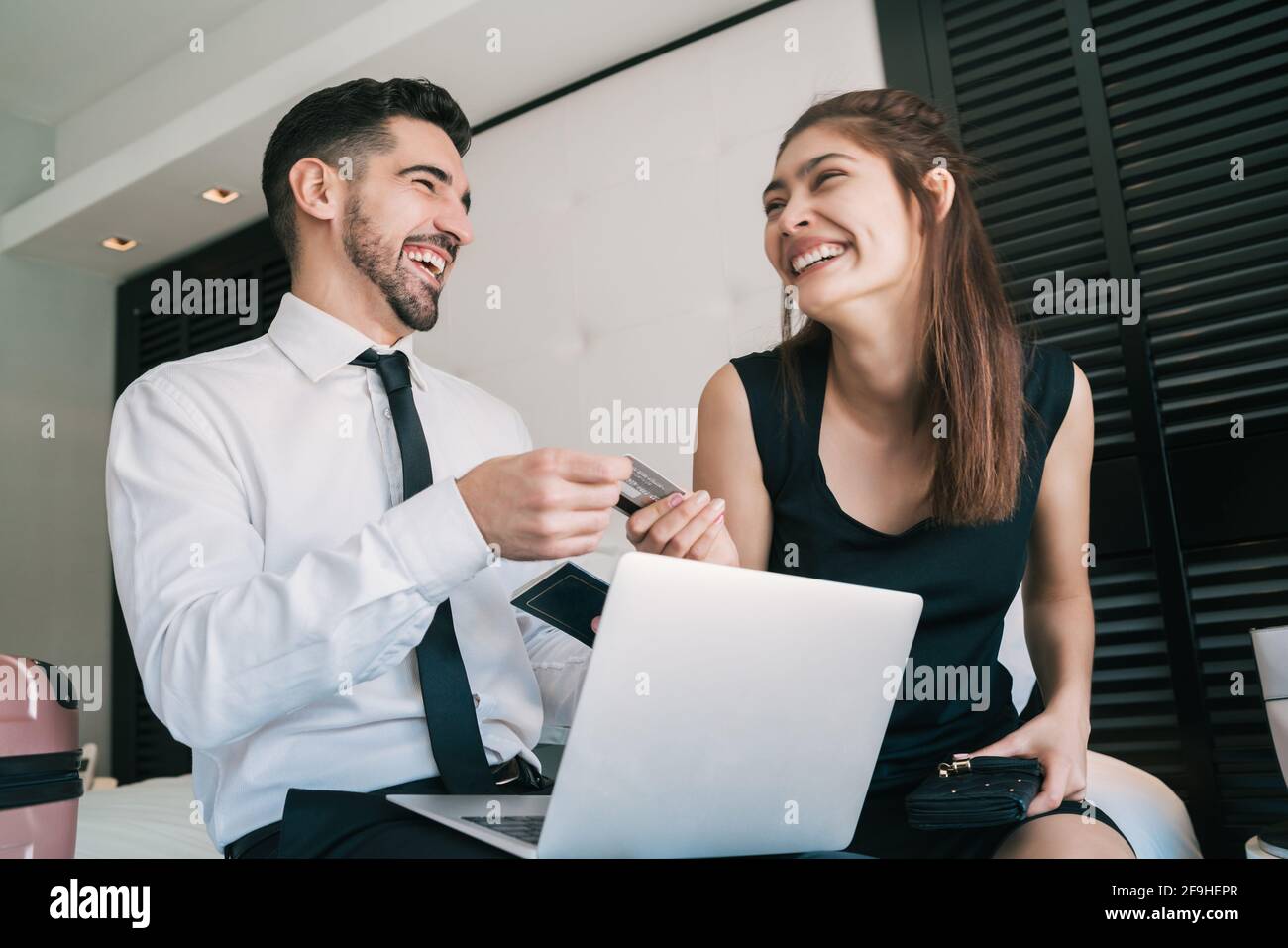 Two business people using credit card for online payment Stock Photo ...