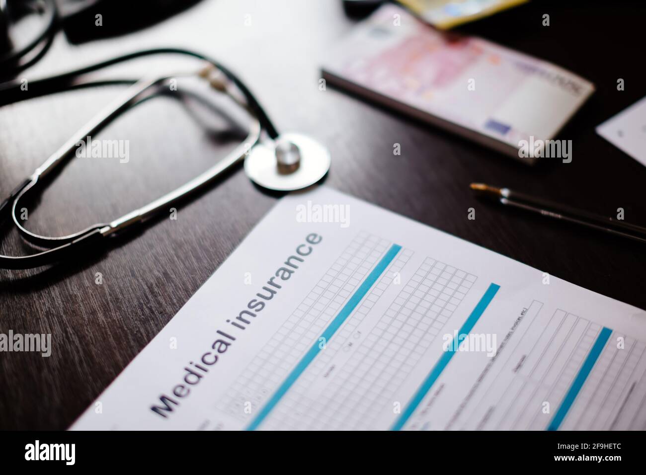 man filling health insurance application Stock Photo - Alamy
