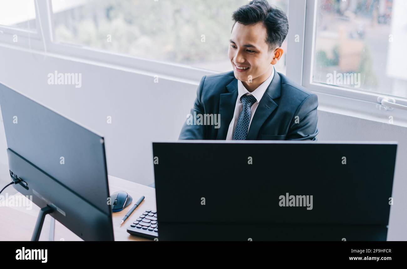 Asian business people are focused on working Stock Photo - Alamy