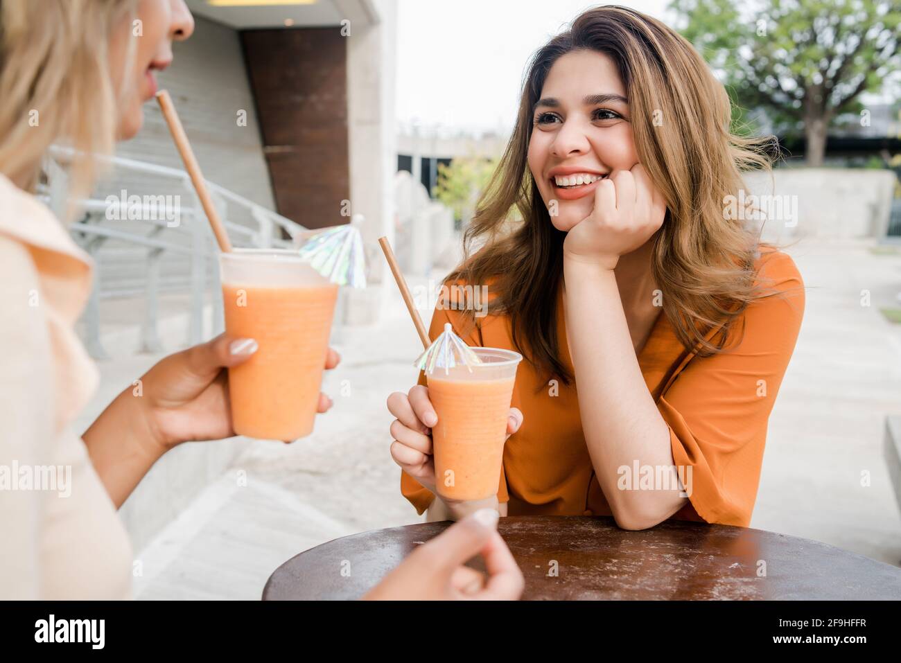 Two friends have fun and enjoy their time together hi-res stock ...