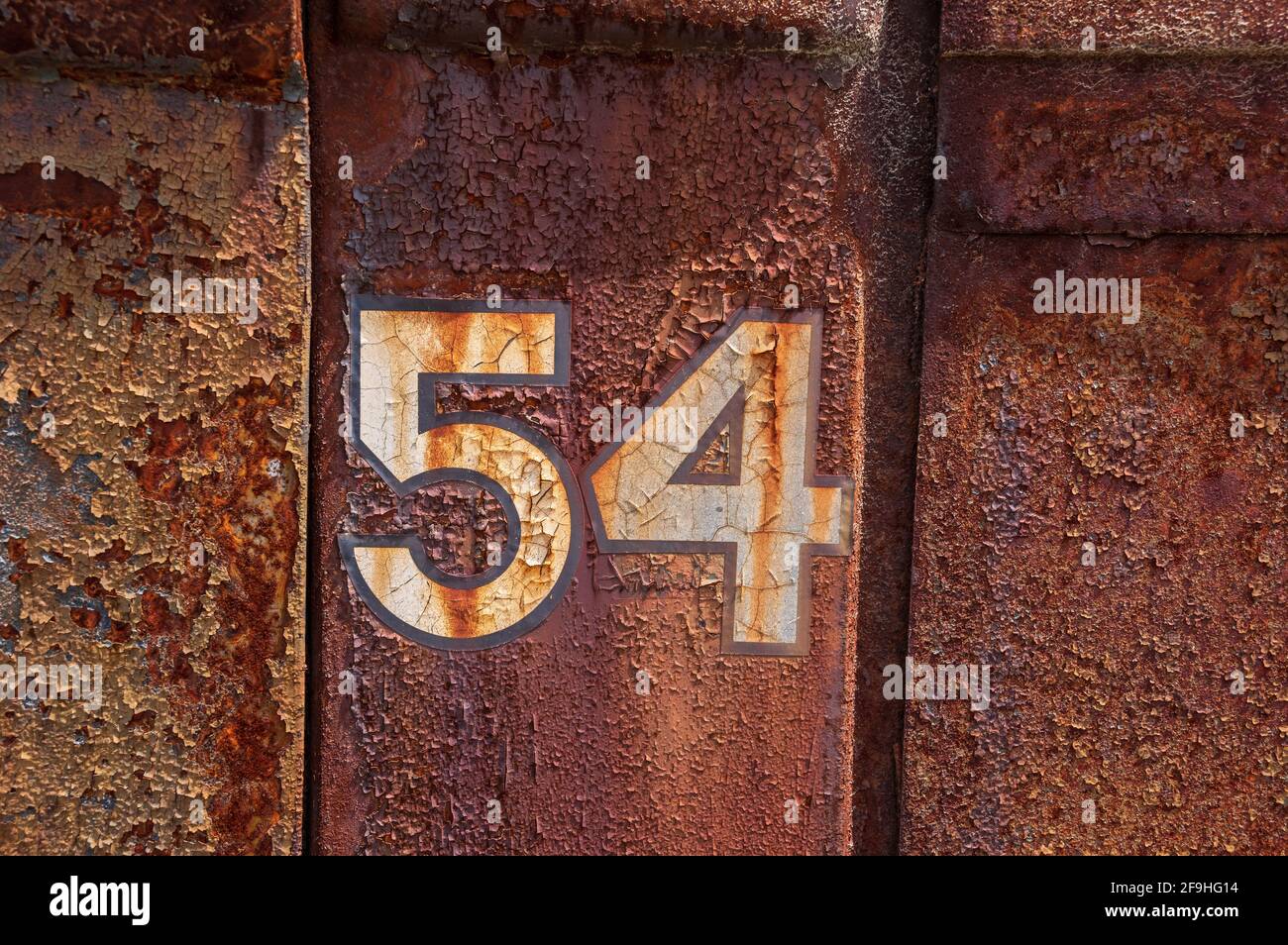 Number 54 painted on side of old rusted truck - number is white/cream ...