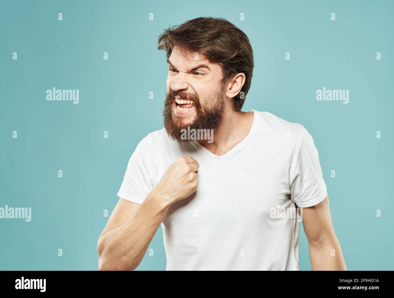 Aggressive man emotions and stress irritability blue background Stock ...