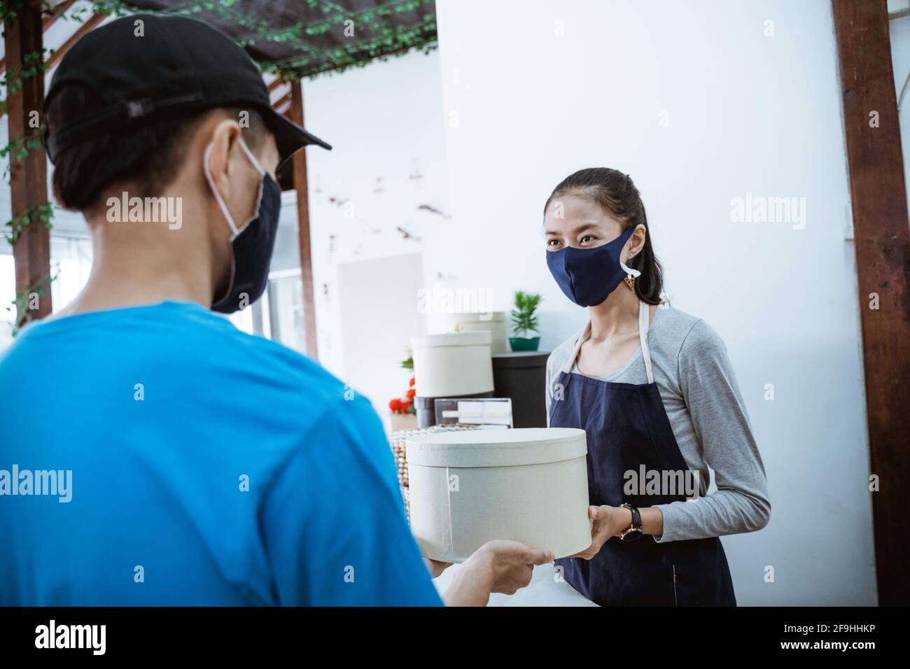 Young asian shopkeeper woman hi-res stock photography and images - Alamy
