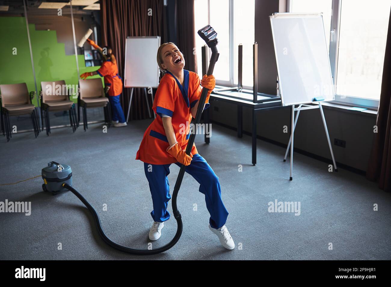 Janitorial staff in the modern office during the clean-up Stock Photo ...