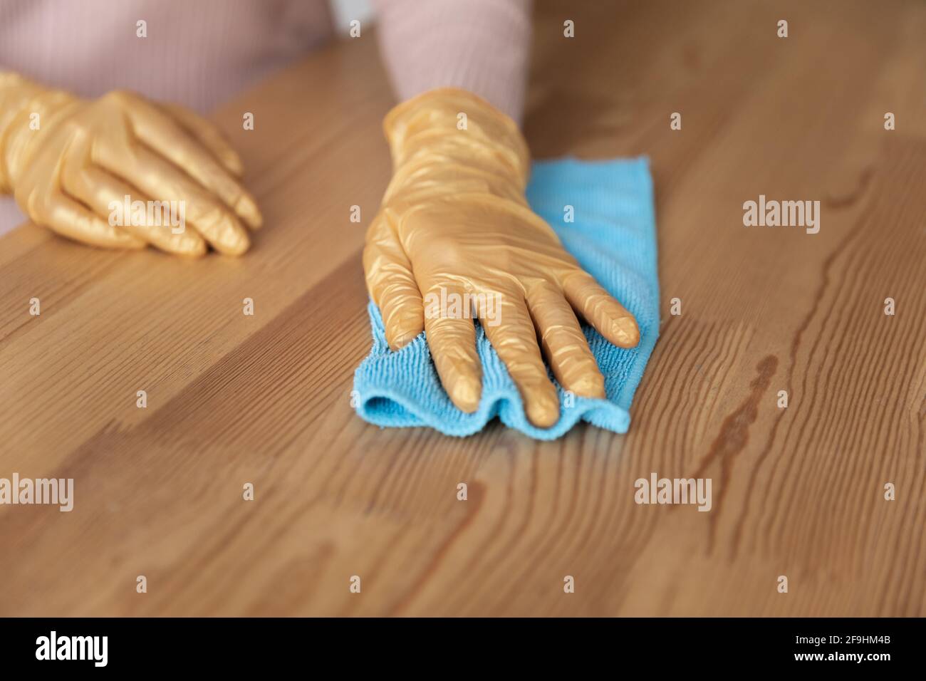 Woman hands in latex gloves rub wooden surface with cloth Stock Photo ...