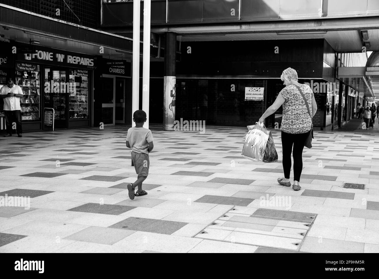 Street life of every day People around Town carrying out normal lives ...
