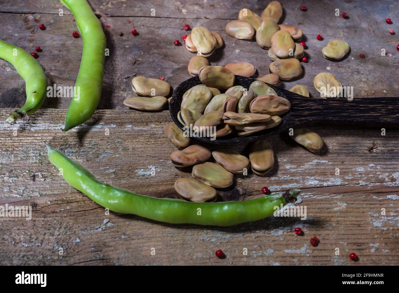 Top view of fresh and dried broad beans in the wooden table Stock Photo ...