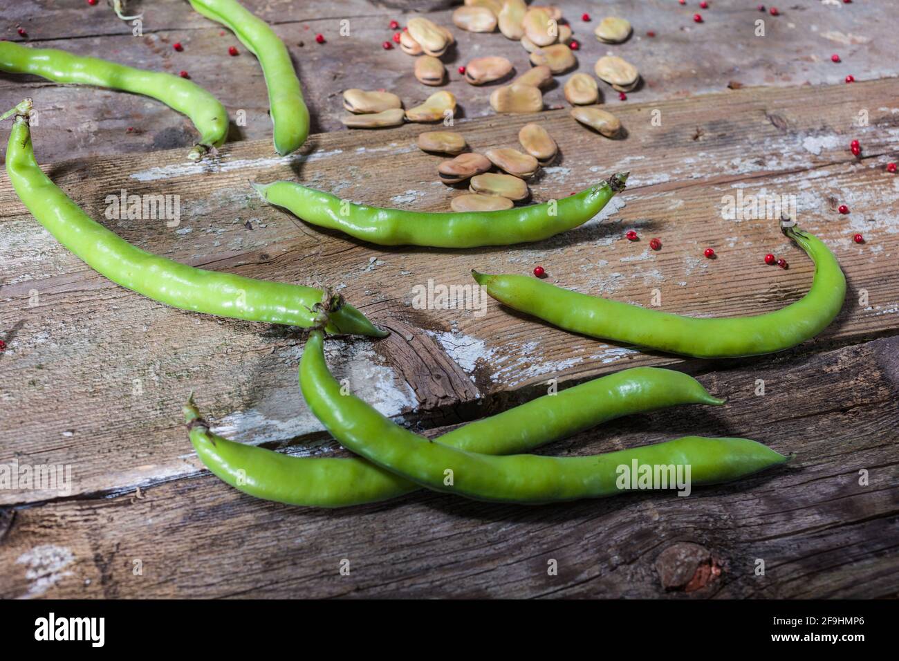 Close up of fresh and dried broad beans in the wooden table Stock Photo ...