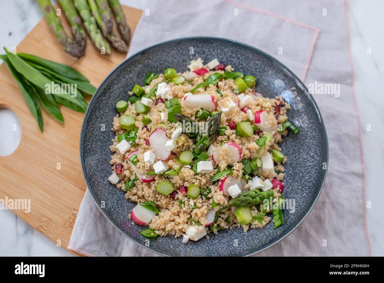healthy spring couscous salad with asparagus and herbs Stock Photo - Alamy