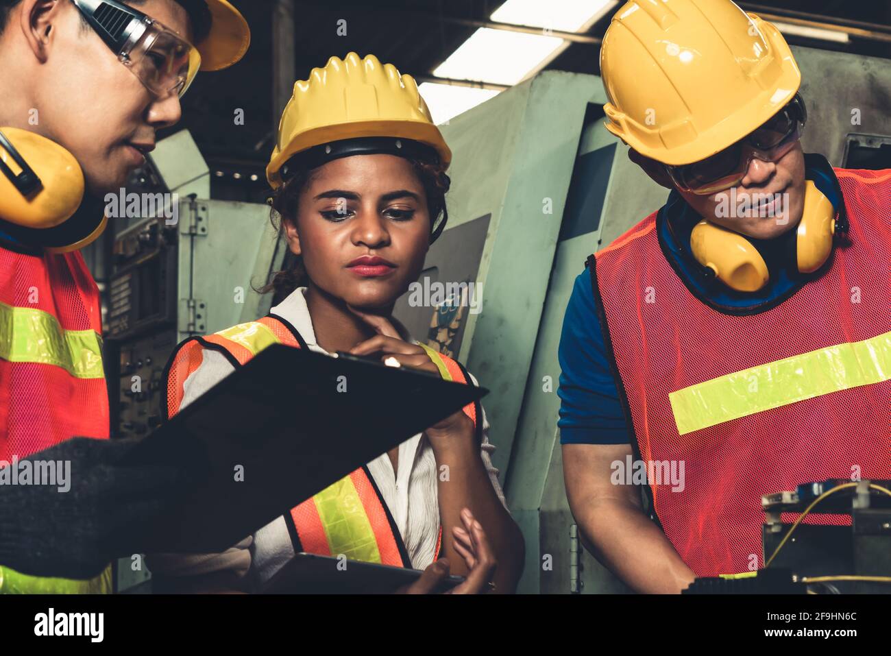 Hispanic young woman assembly line hi-res stock photography and images - Alamy
