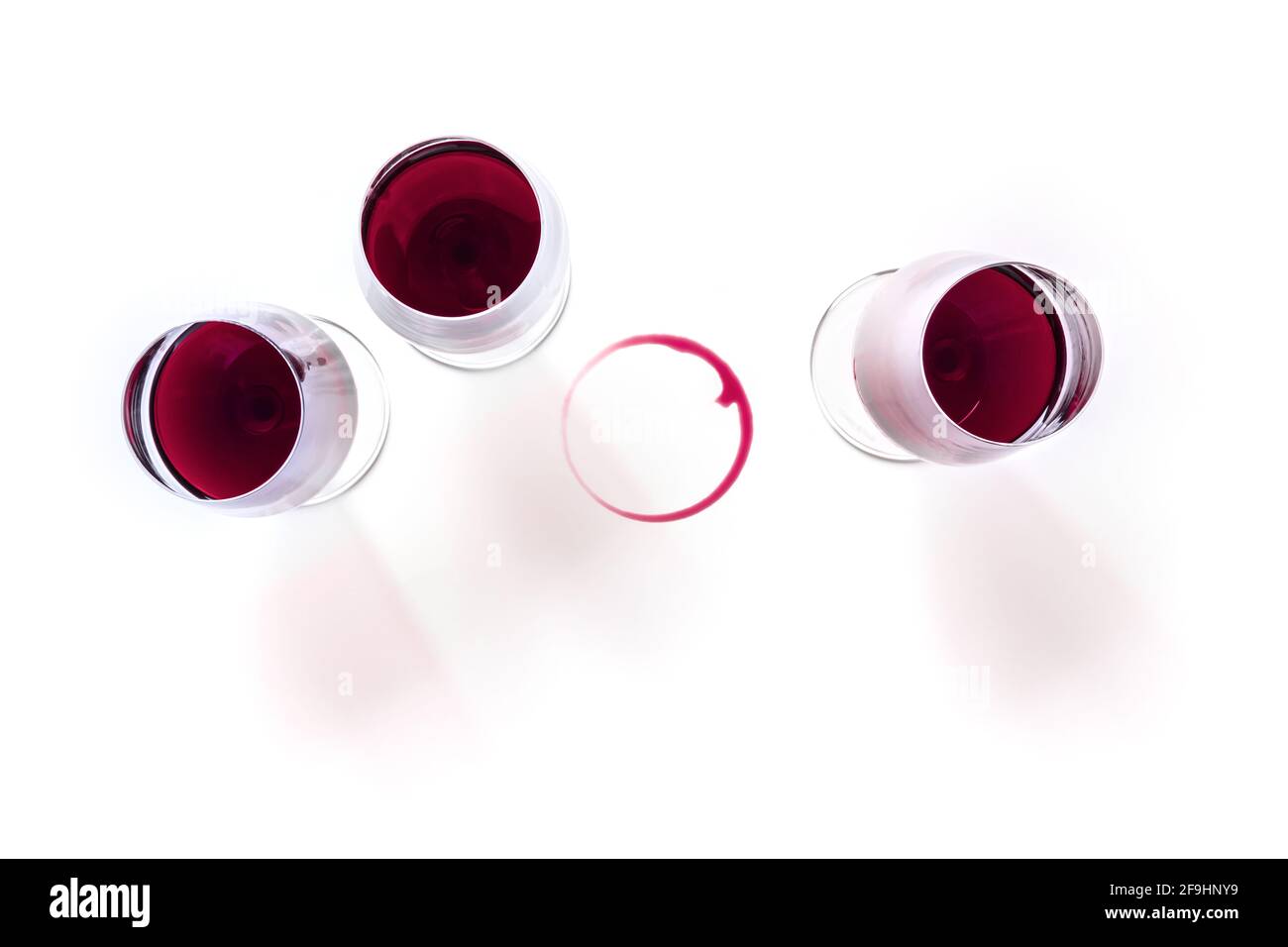 Wine glasses and a wine ring, shot from the top on a white background ...