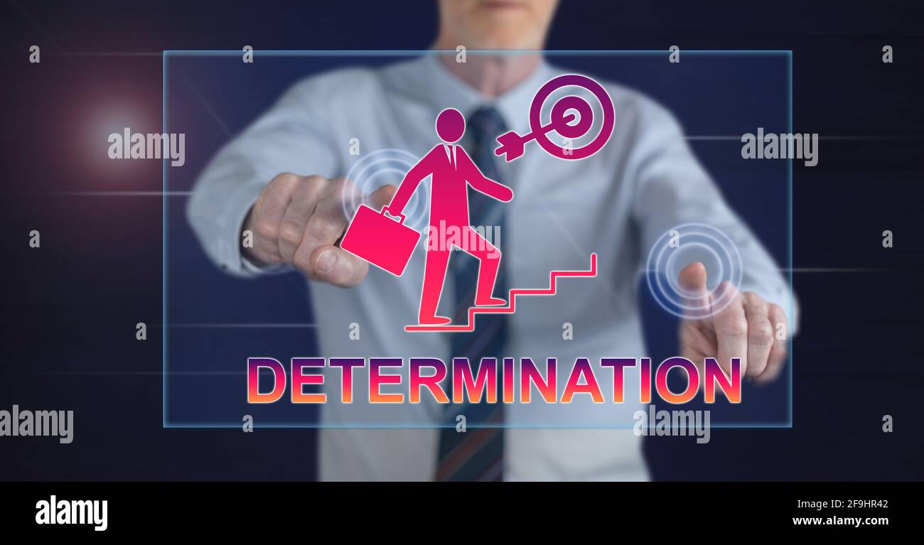 Man touching a determination concept on a touch screen with his fingers ...