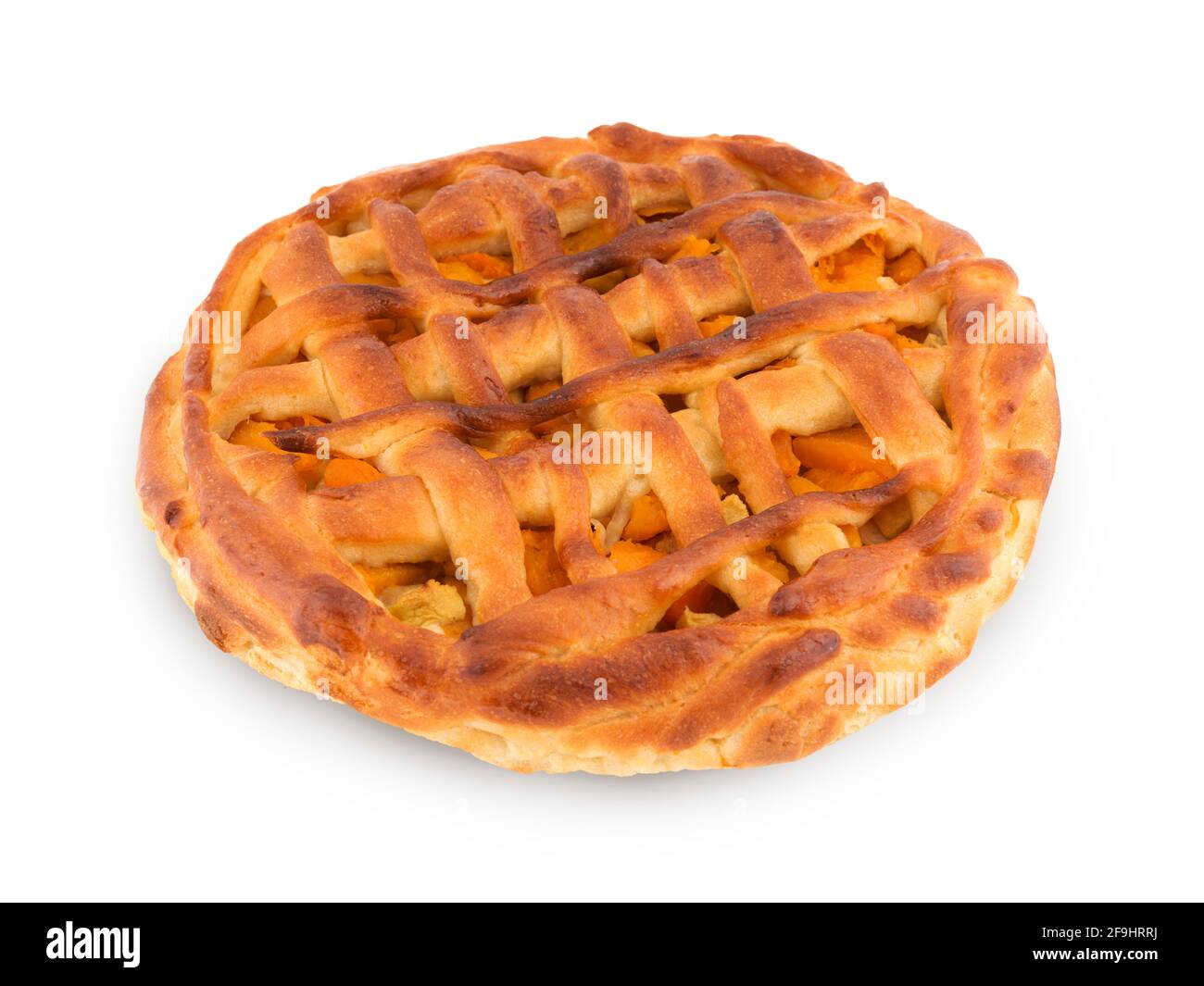 Homemade round pie with apricot filling isolated on white. Cooking at ...