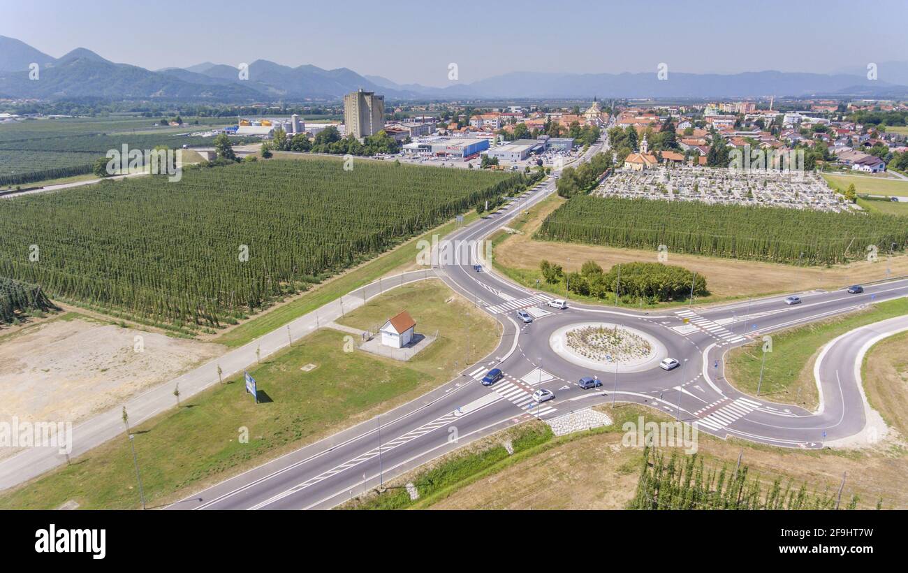 Aerial shot of a roundabout at the entrance to a small town with ...