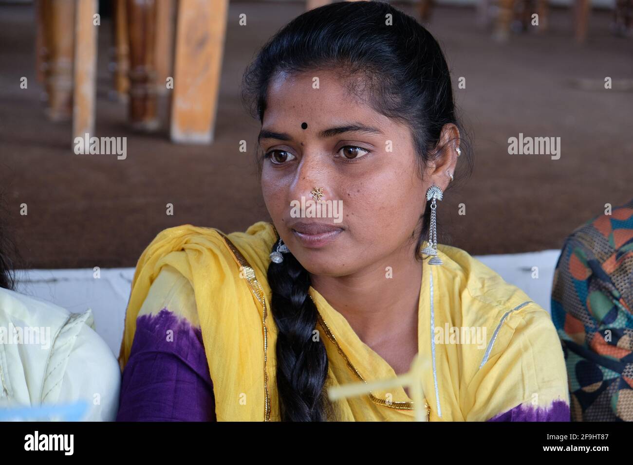 Young Indian Woman Wearing A Traditional Sari Dress Staring At