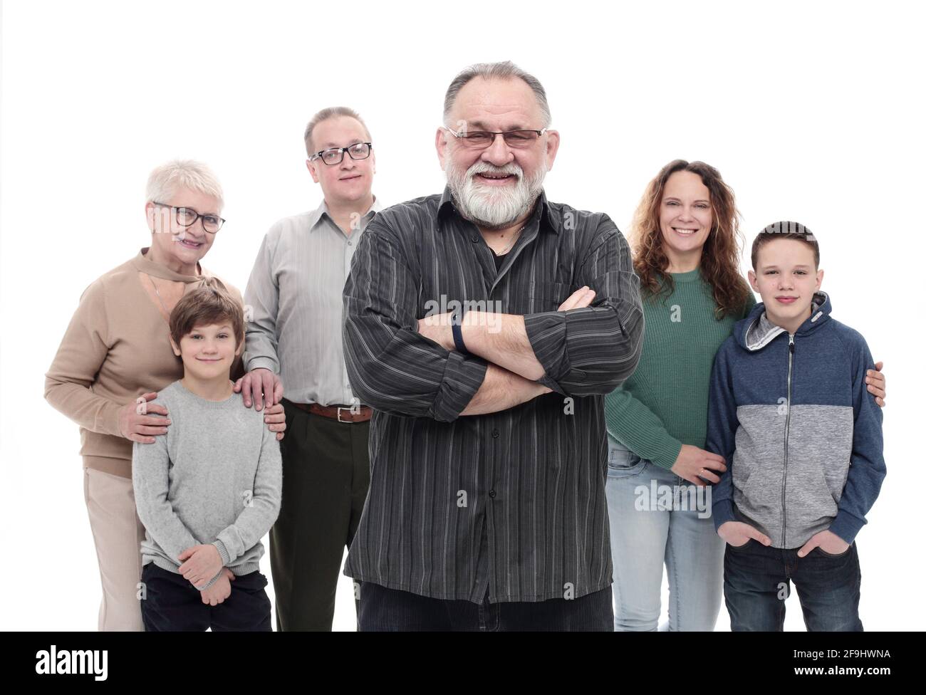 happy grandfather standing in front of his family Stock Photo - Alamy