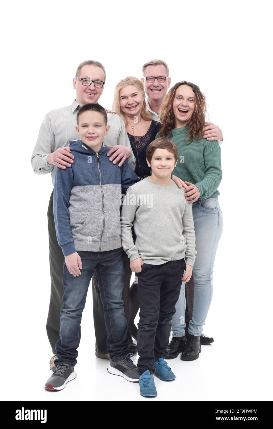 in full growth. happy family standing together Stock Photo - Alamy