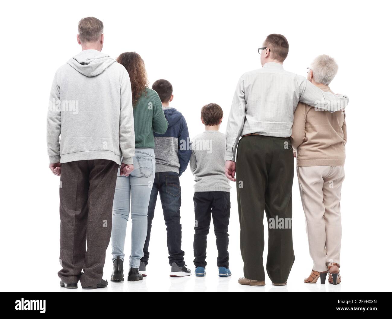 rear view. large family looking at a white screen Stock Photo - Alamy