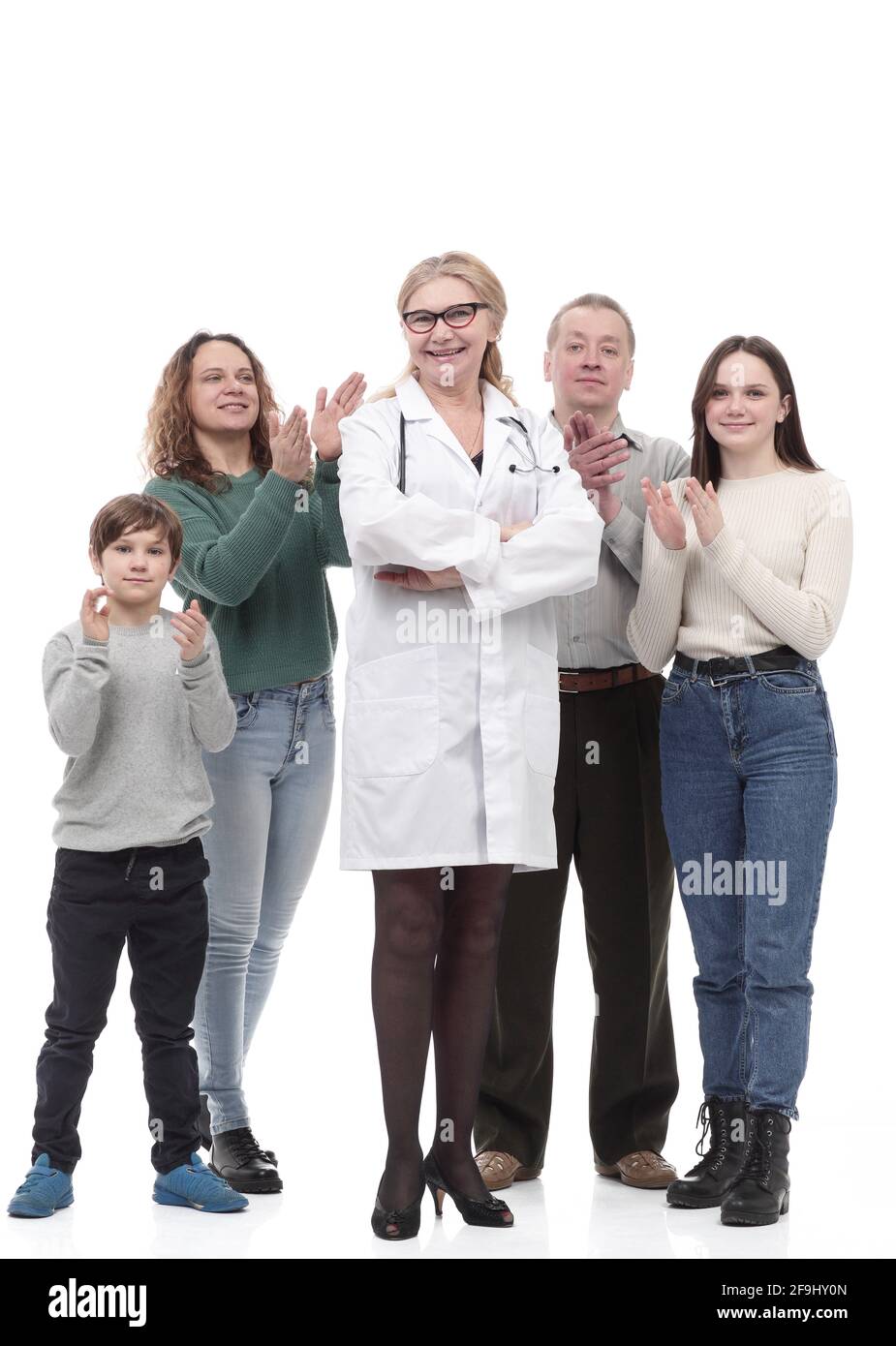 happy family and their family doctor standing together Stock Photo - Alamy