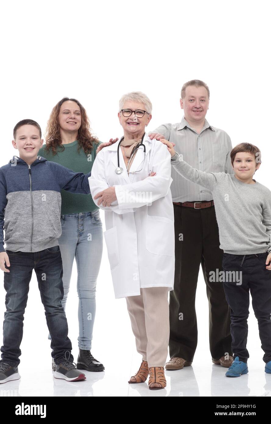 happy family and their family doctor standing together Stock Photo - Alamy