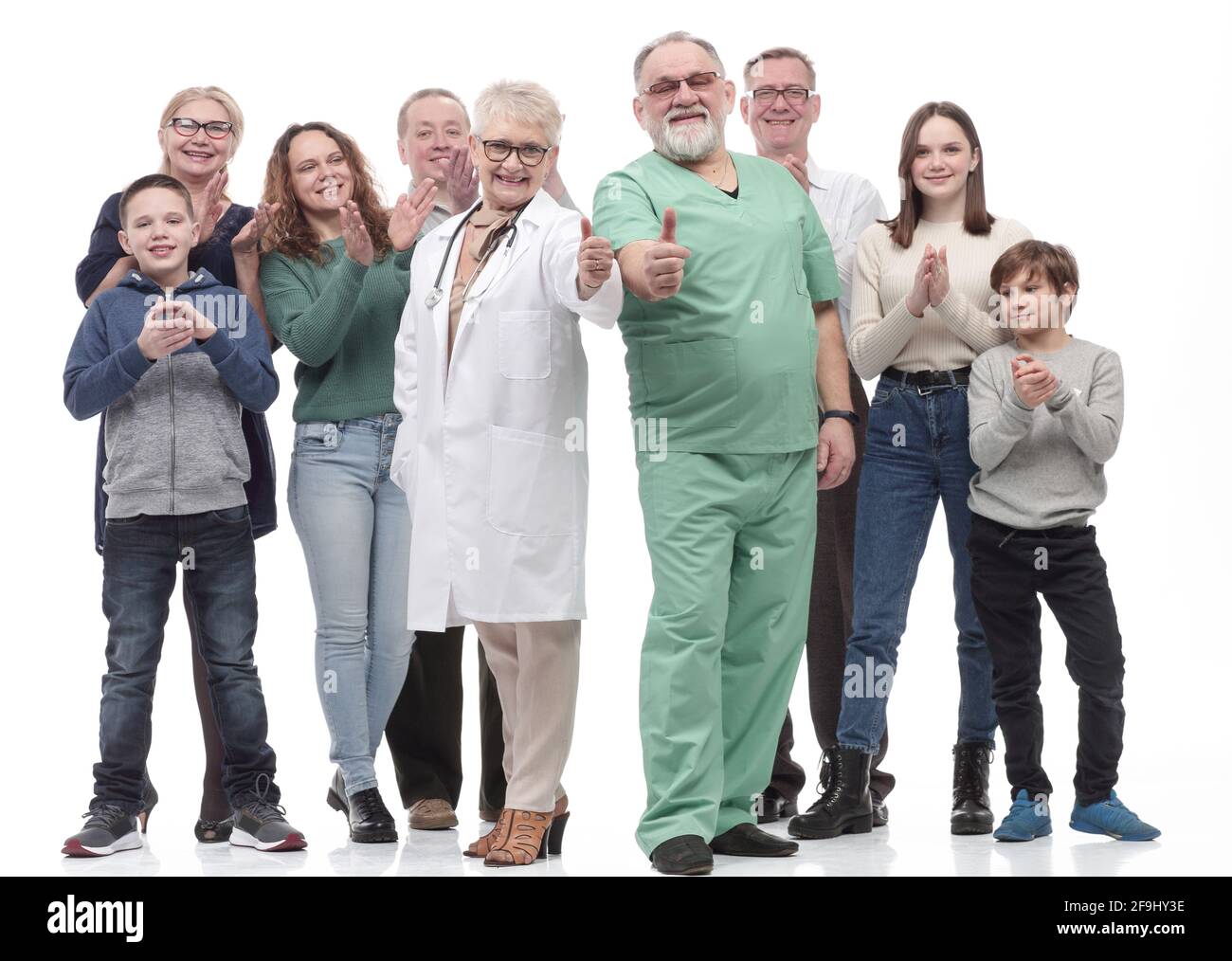 happy family and their family doctor standing together Stock Photo - Alamy