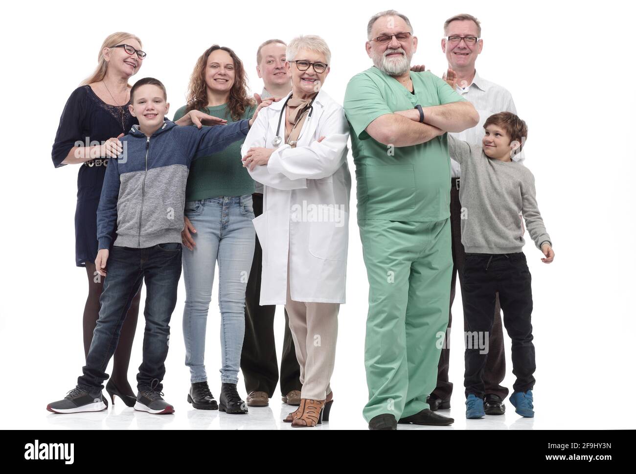 happy family and their family doctor standing together Stock Photo - Alamy