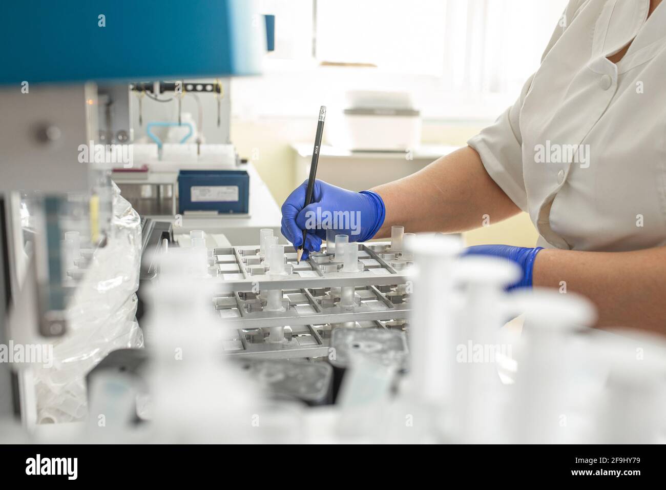 Doctor healthcare worker filling out hi-res stock photography and ...
