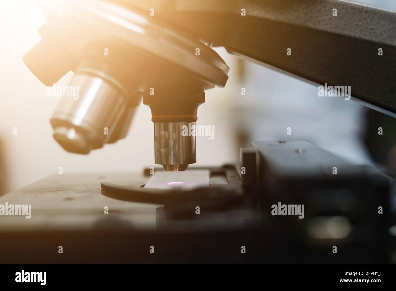 A close up picture of objective lens and stage of a microscope made ...