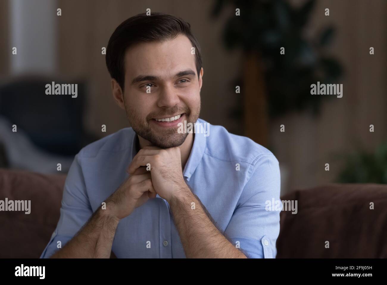 Smiling man look in distance thinking dreaming Stock Photo - Alamy