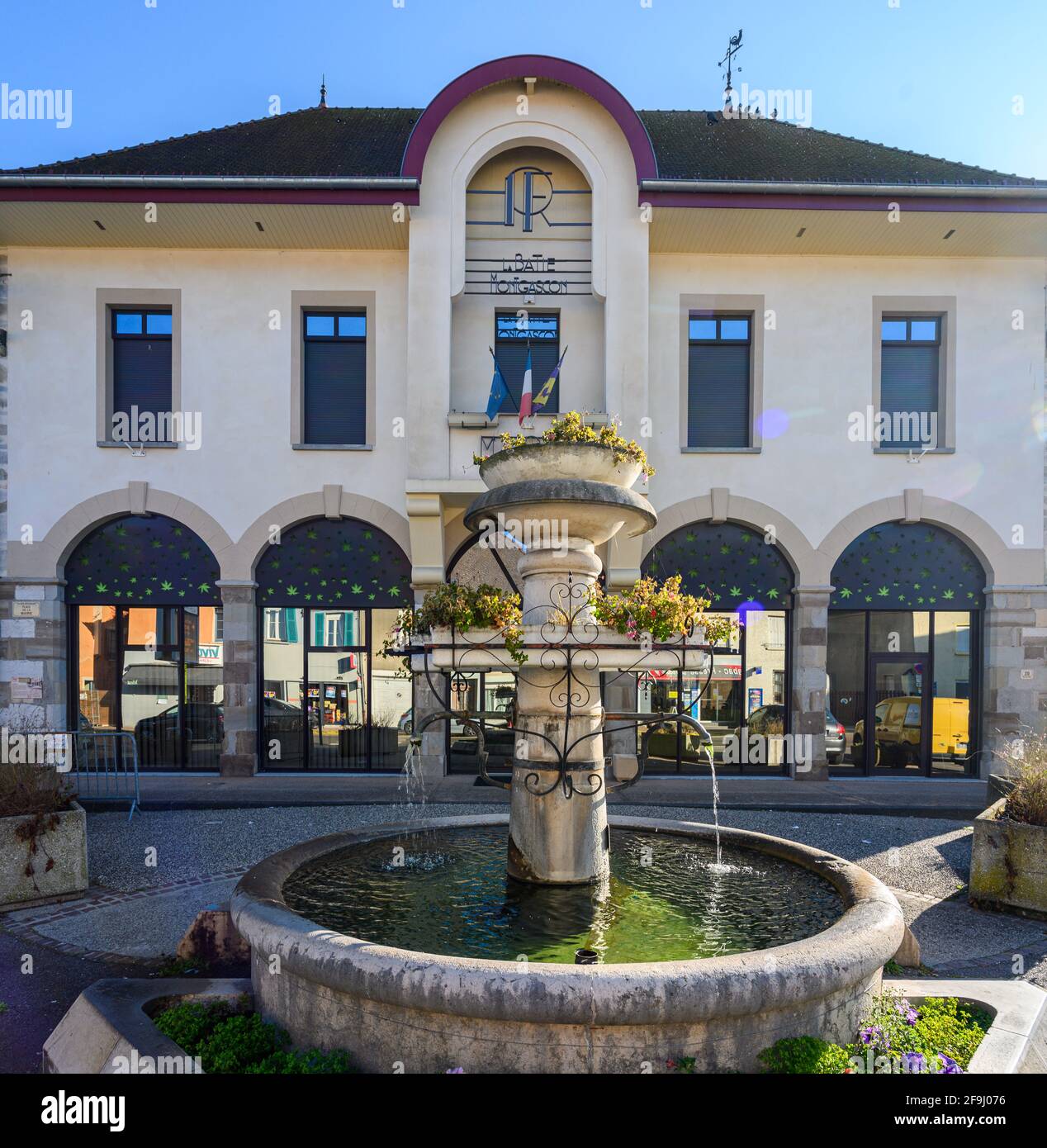 A beautiful portrait of the town hall La Batie Montgascon, featuring a ...