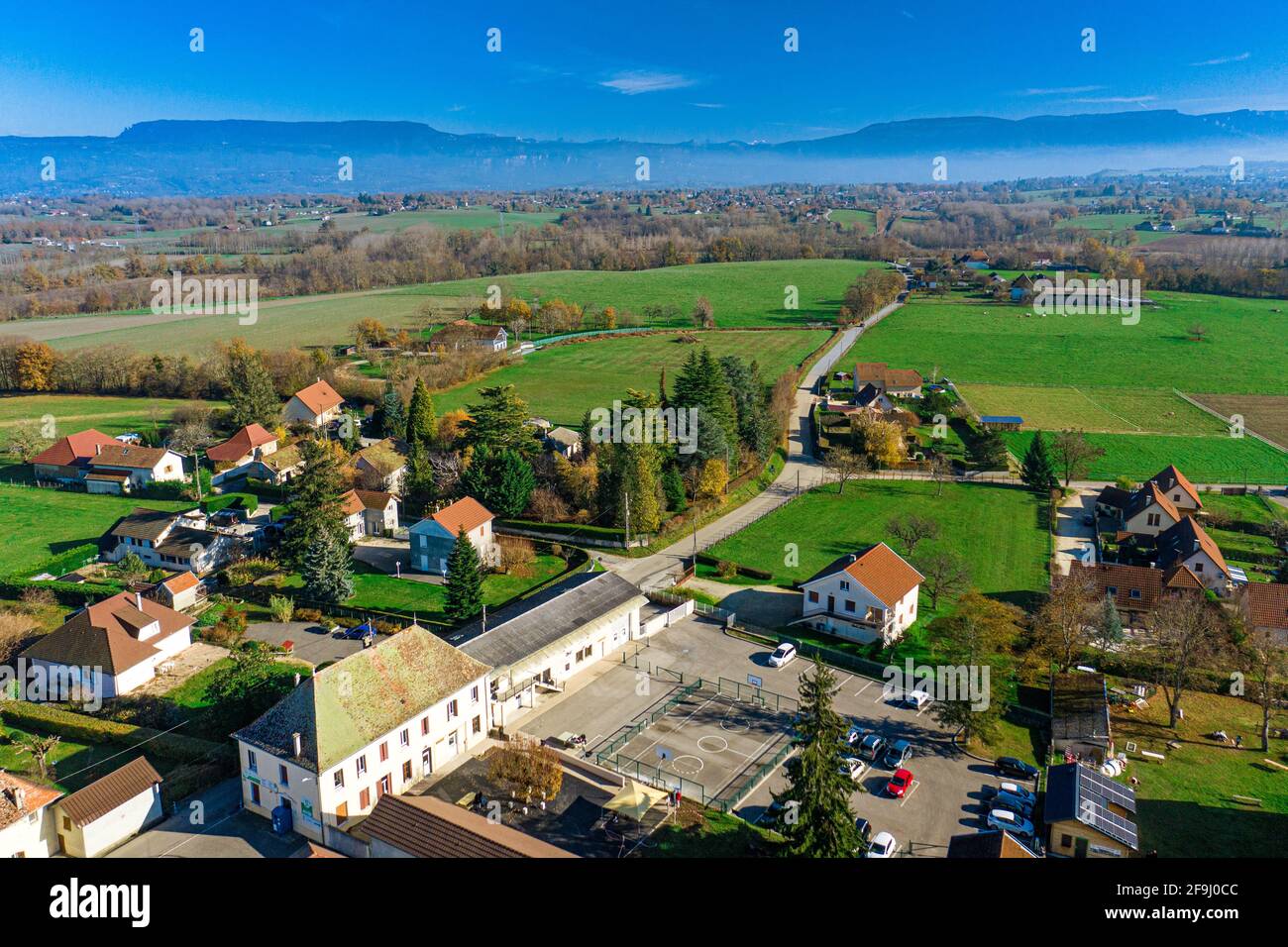 Perspective aerial shot of small french village, featuring rooftop view ...
