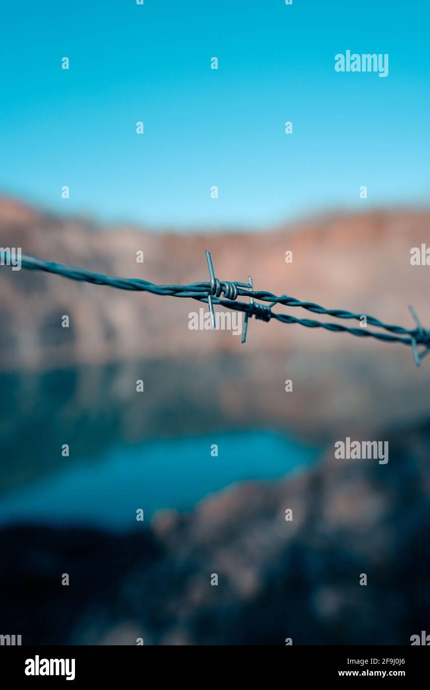 Vertical shot of a detail of a barbed wire Stock Photo - Alamy