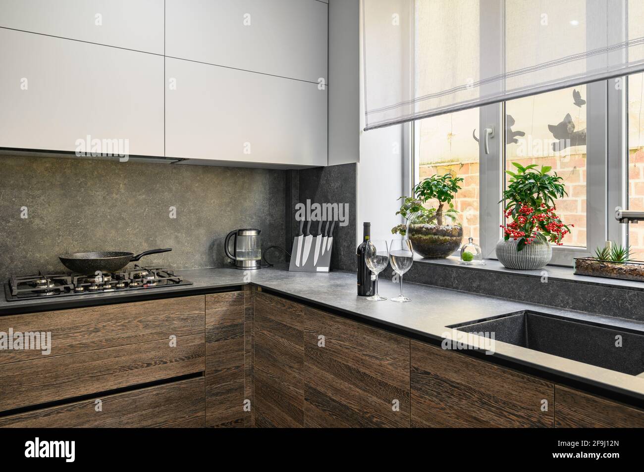 Modern luxury large dark brown, gray and black kitchen details Stock ...
