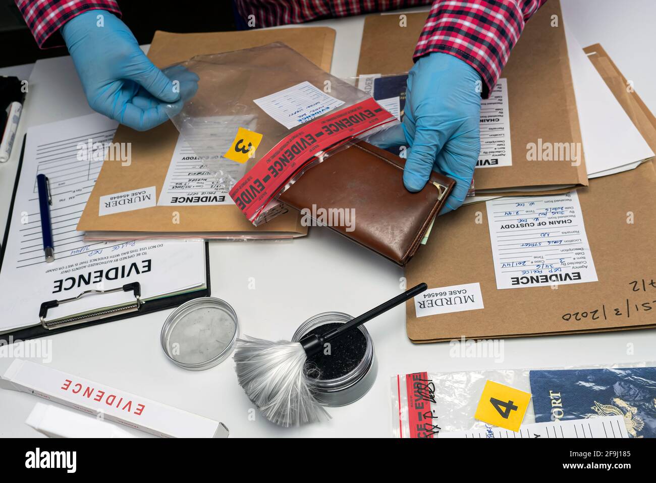 Specialised police officer takes wallet with money out of a murder ...