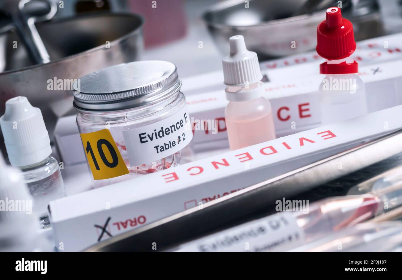 Blood-stained glass sample in an evidence cup, concept image Stock ...