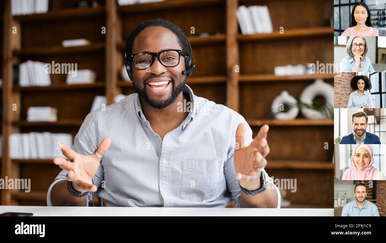 Ambitious African-American businessman holding online video conference ...